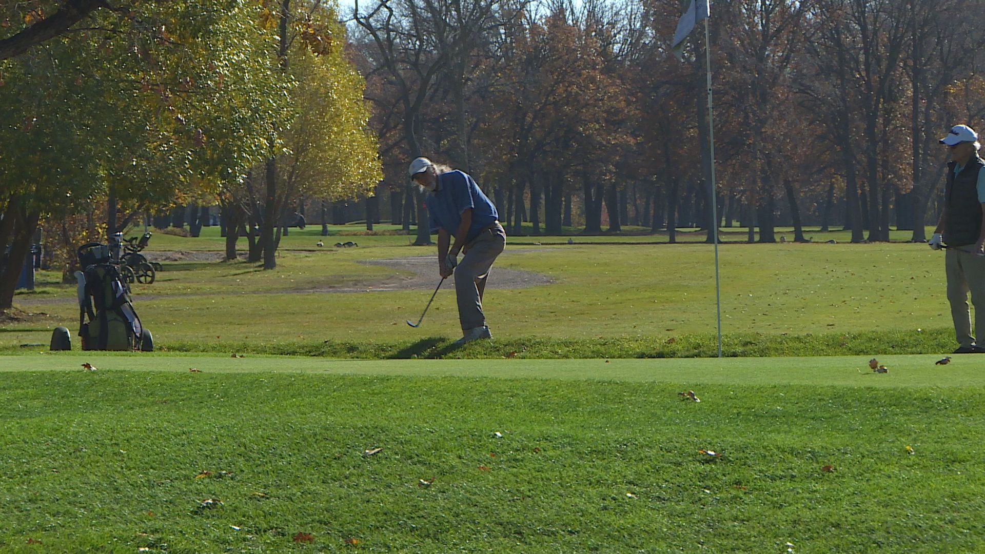 Local golfer embrace unseasonable October sunshine