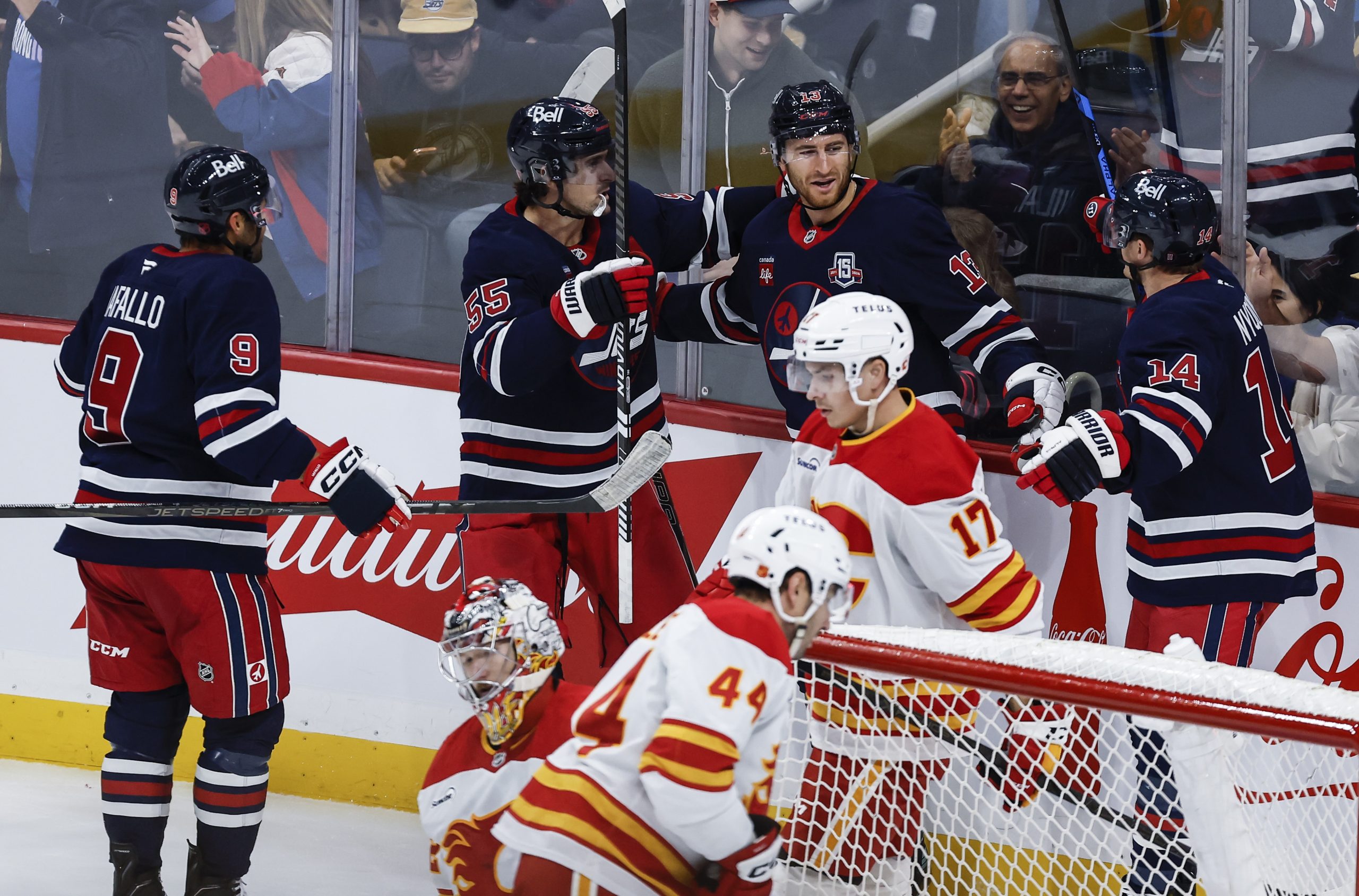 Jets use power play to soar past Flames 5-3